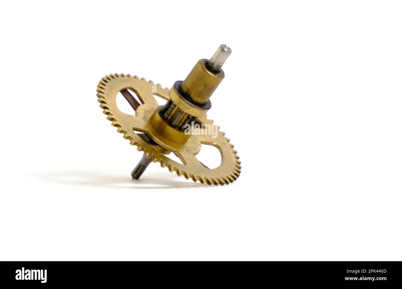 Metal gear from mechanical watch on white background Stock Photo - Alamy