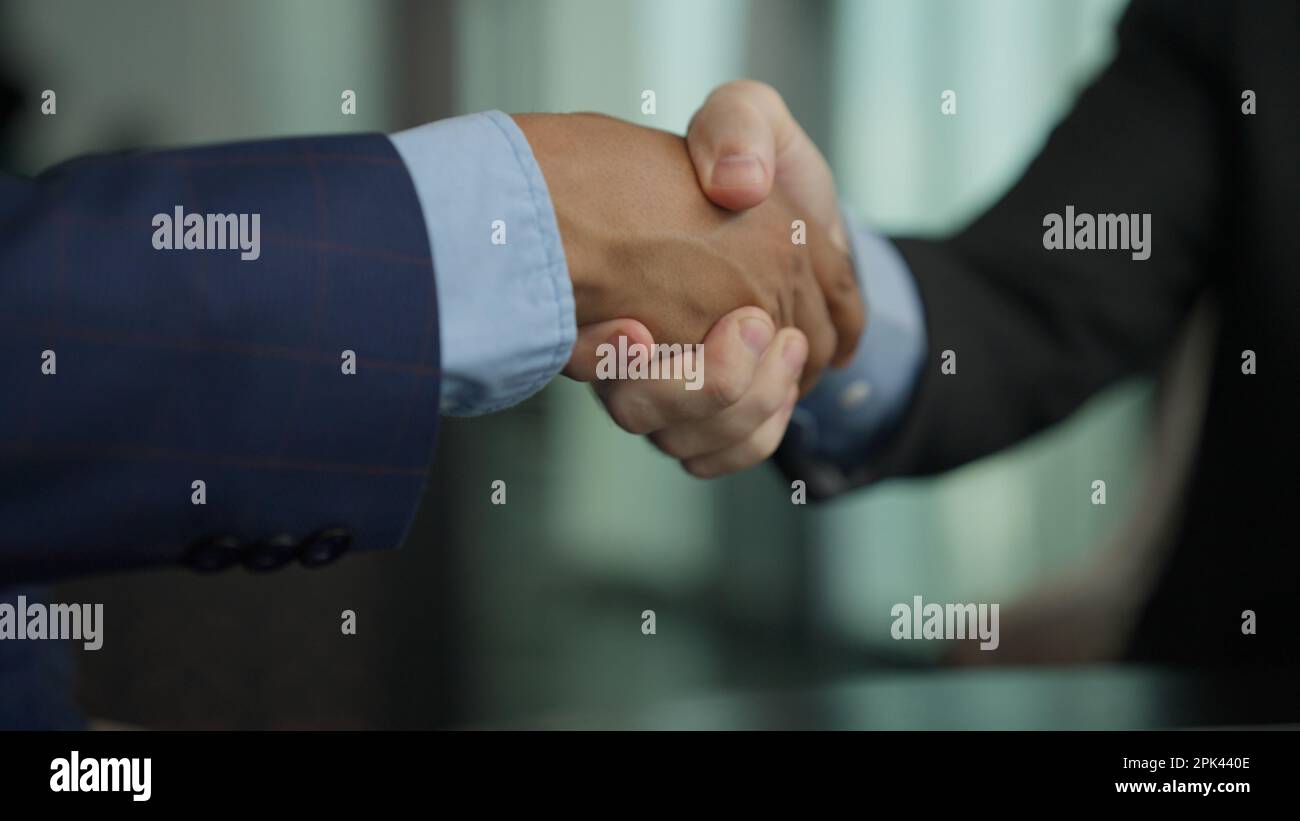 Business people shacking hands together showing successful contract ...