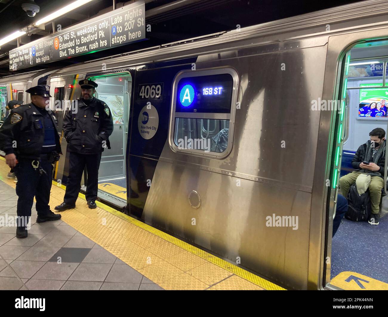 NYPD officers on the platform outside an A train in the subway in New ...