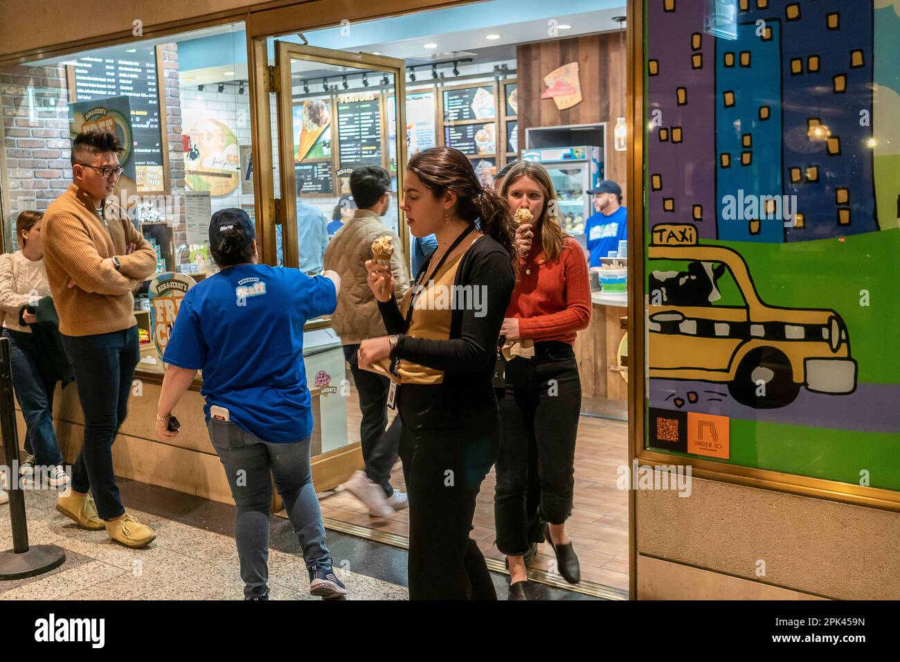 Workers in Rockefeller Center leave the Ben & Jerry's ice cream store ...