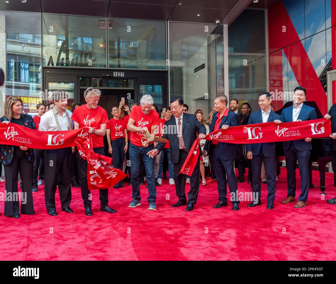 Sir Richard Branson, center, with guests and executives from The Lam ...