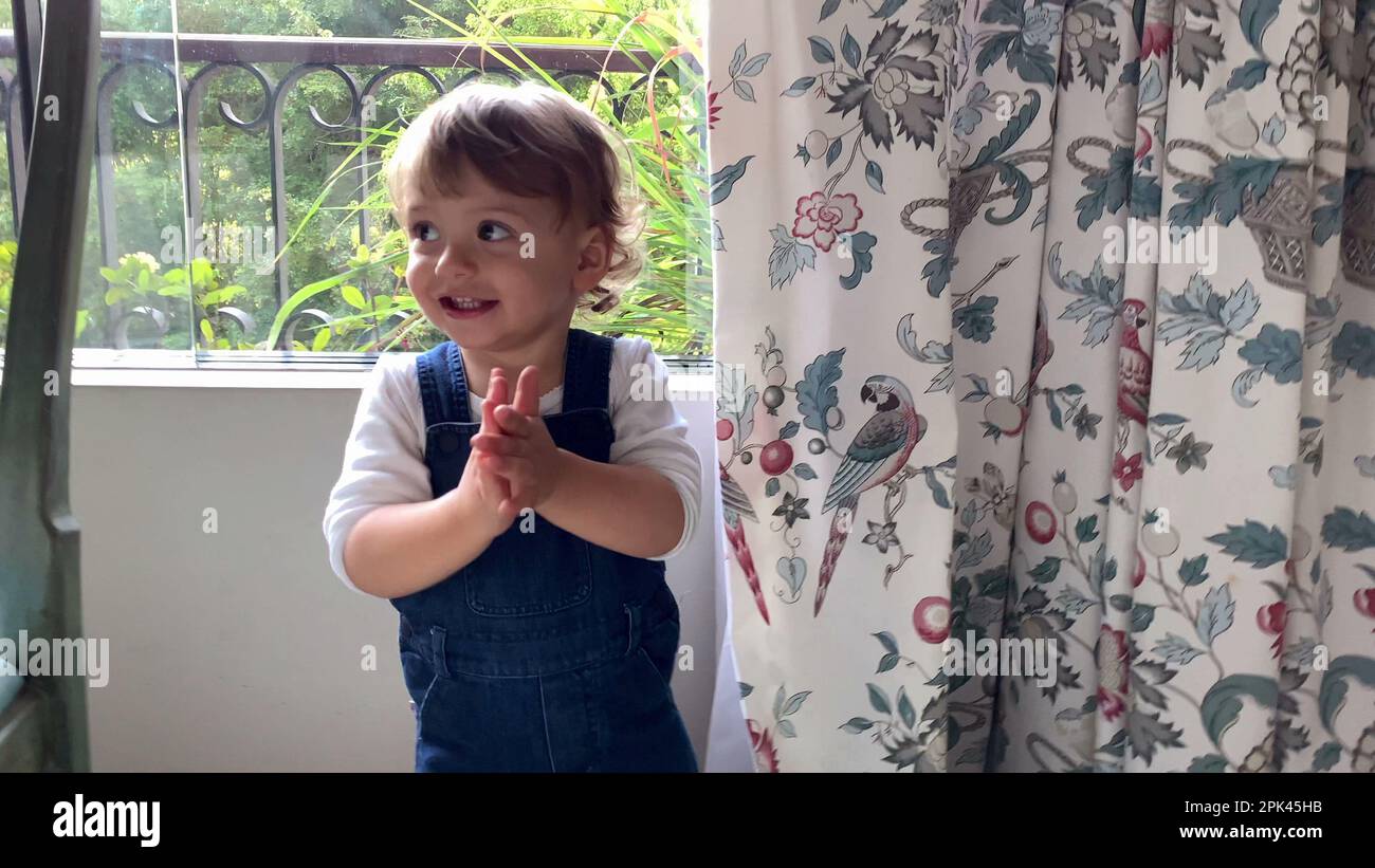 Adorable baby clapping hands, excited happy toddler claps Stock Photo ...