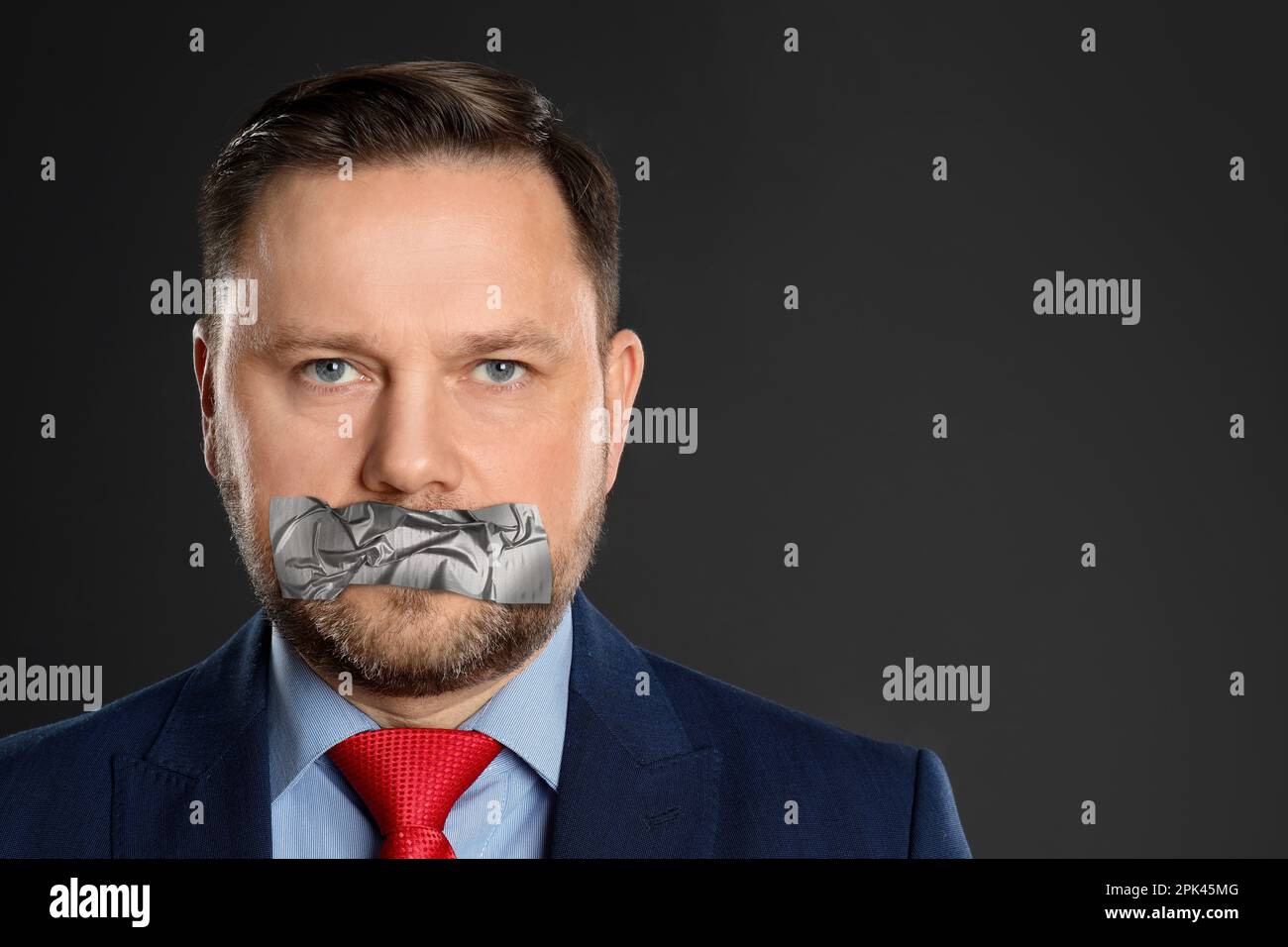 Mature man with taped mouth on grey background. Speech censorship Stock ...