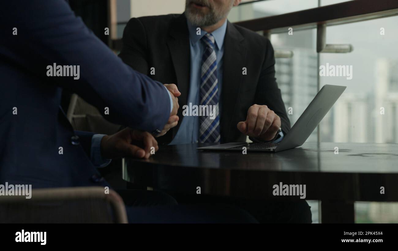 Business people shacking hands together showing successful contract ...