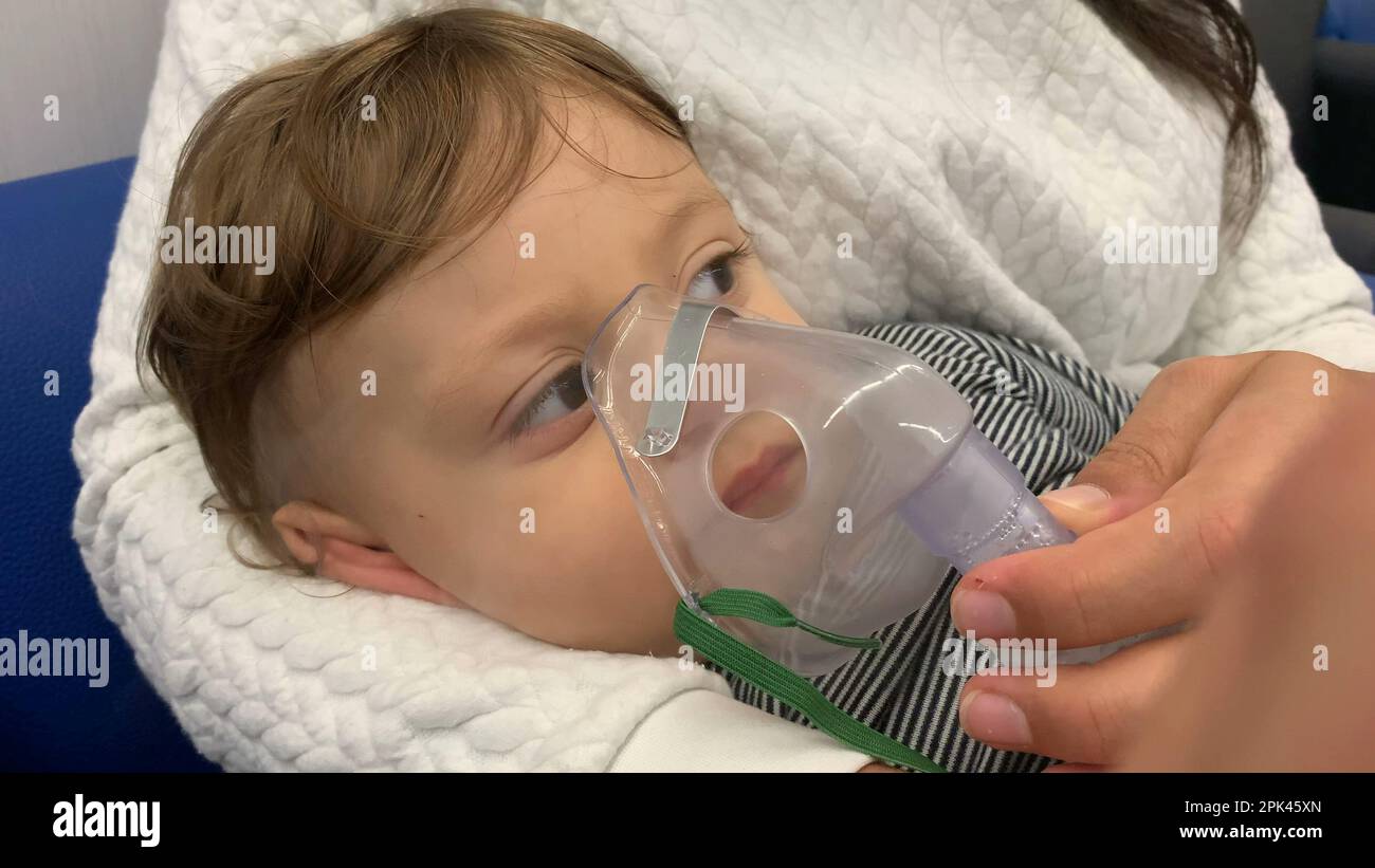 Baby infant with inhaler equipment at hospital Stock Photo - Alamy