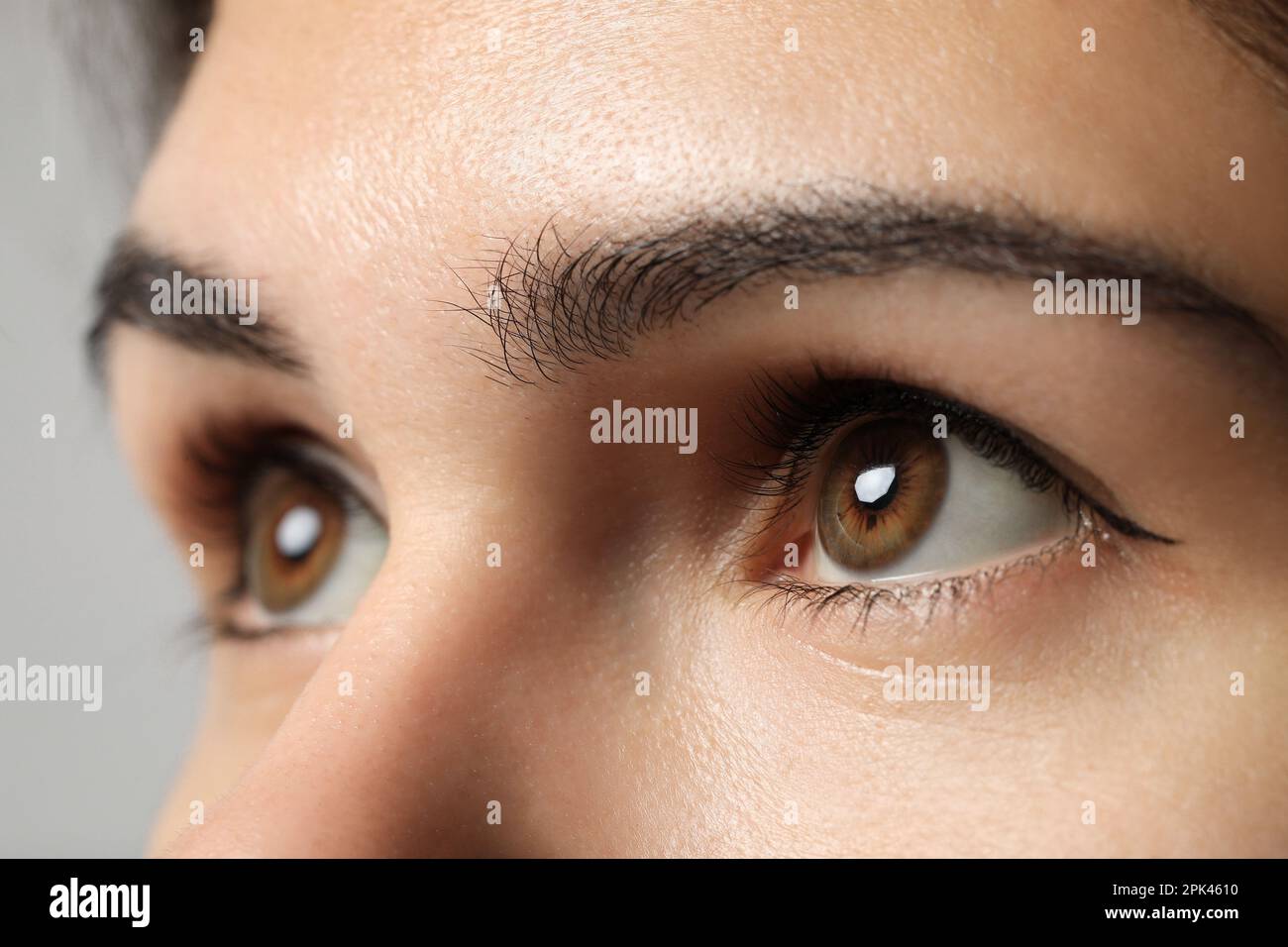 Pretty Girl With Brown Curly Hair And Hazel Eyes