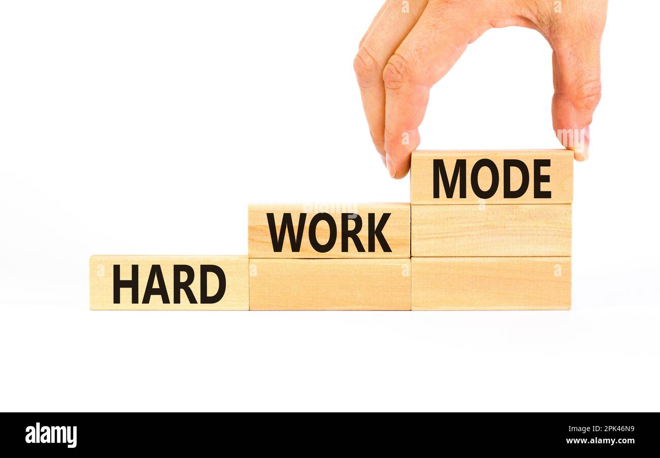 Hard work mode symbol. Concept words Hard work mode on wooden block on ...