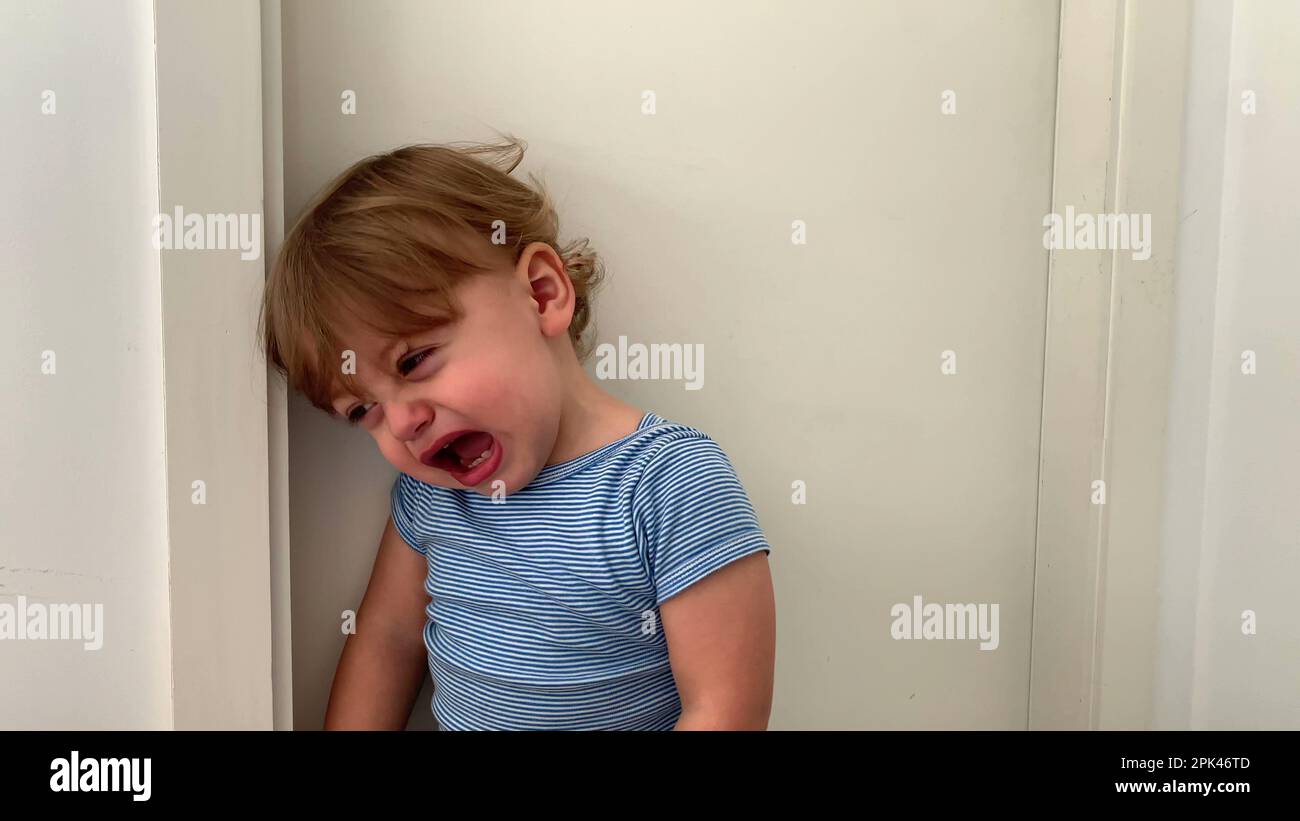 Baby toddler tantrum crying wanting mother Stock Photo - Alamy