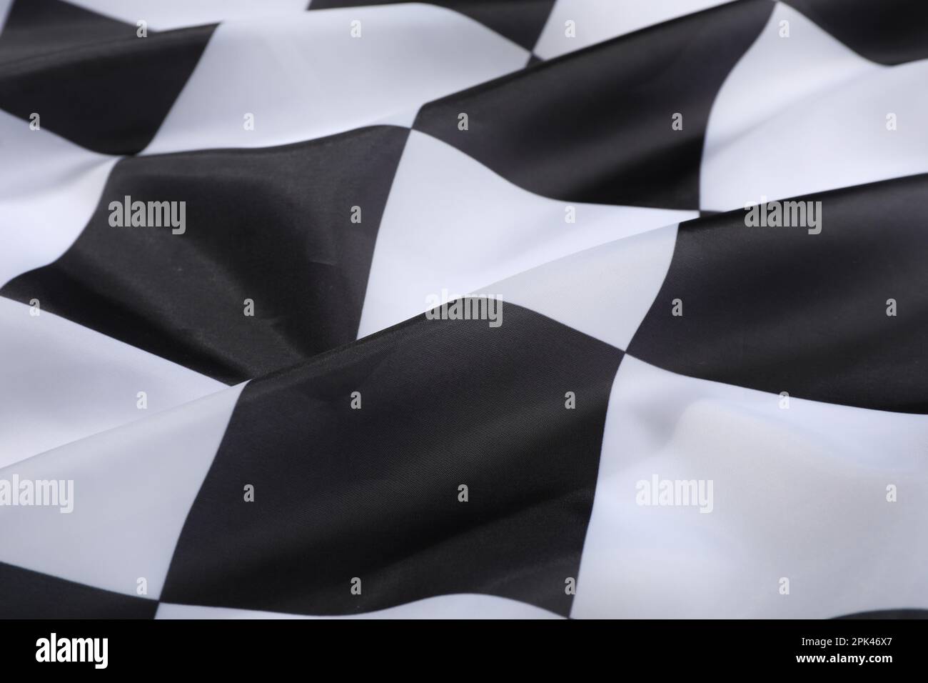 Checkered finish flag as background, closeup view Stock Photo - Alamy