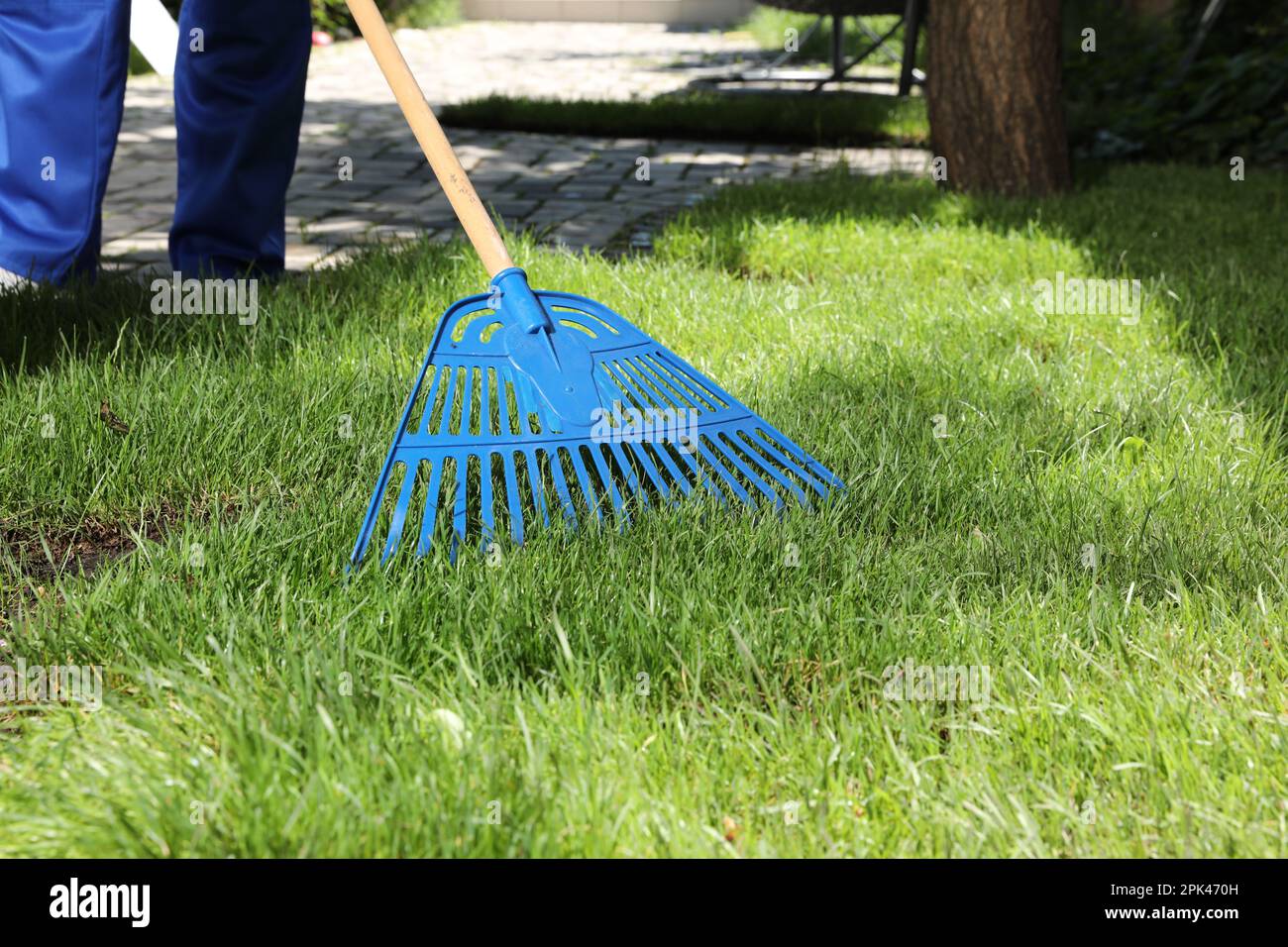 Gardener raking ground hi-res stock photography and images - Alamy