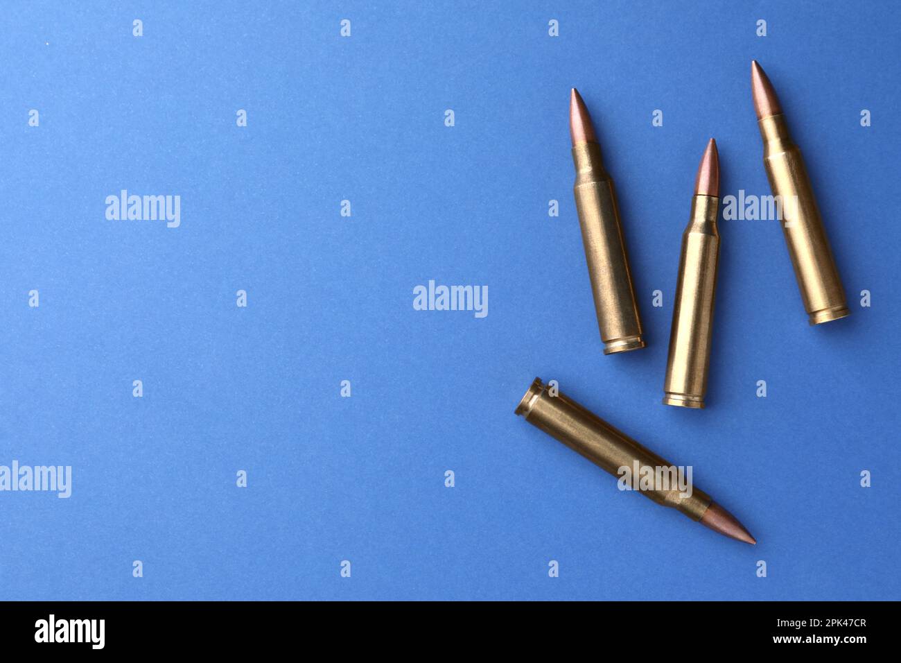 Bullets on blue background, flat lay. Space for text Stock Photo - Alamy