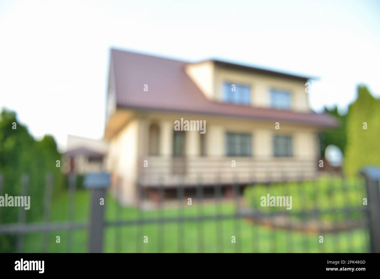 Blurred view of modern house and beautiful garden Stock Photo - Alamy