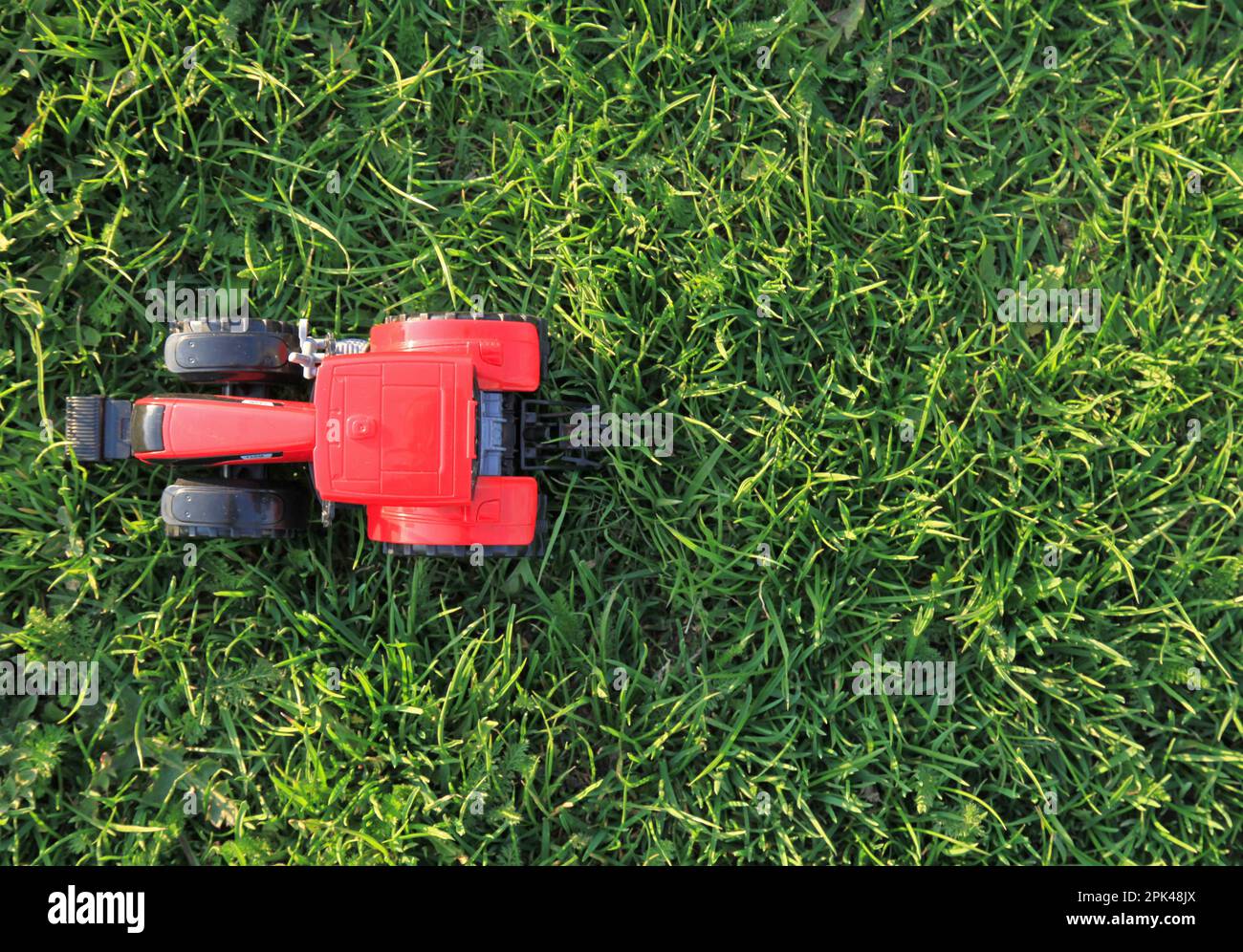 Red tractor sows seeds on hi-res stock photography and images - Alamy