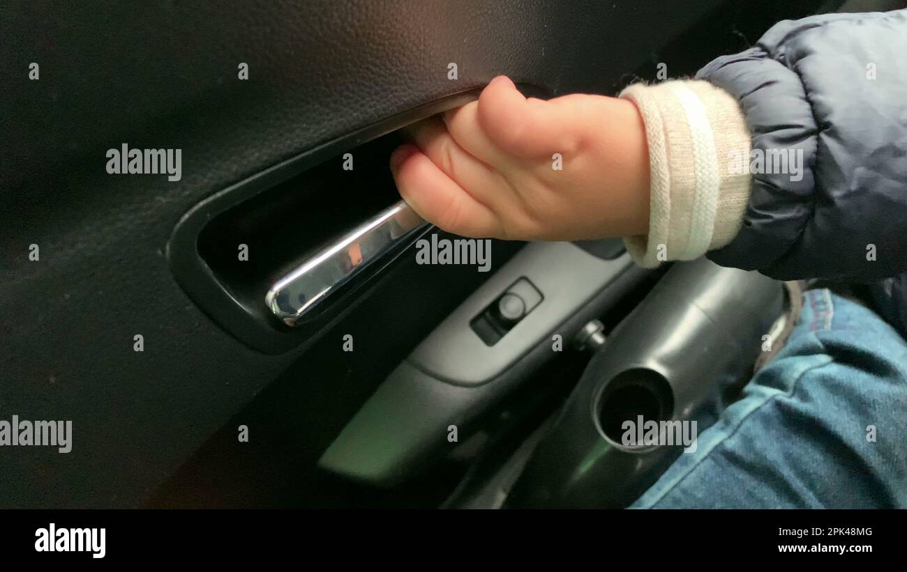 Child unable to open car handle because of lock safety prevention Stock ... Child unable to open car handle because of lock safety prevention Stock ...