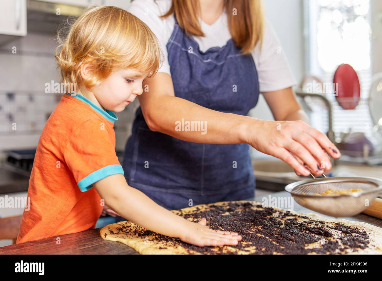 Mother and son boy making cookies and having fun in the kitchen Stock ...