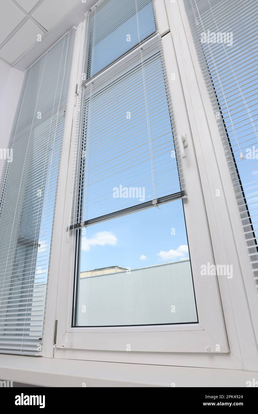 Window with horizontal blinds indoors, low angle view Stock Photo - Alamy