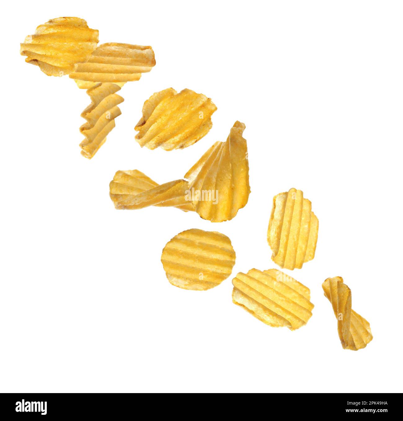 Ridged crispy potato chips flying on white background Stock Photo - Alamy