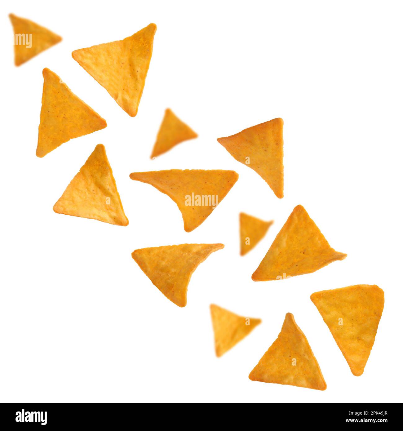 Tasty tortilla chips (nachos) falling on white background Stock Photo ...