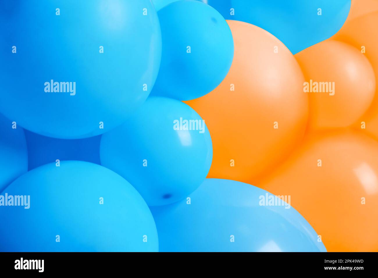 Many orange and light blue balloons as background, closeup. Party decor ...