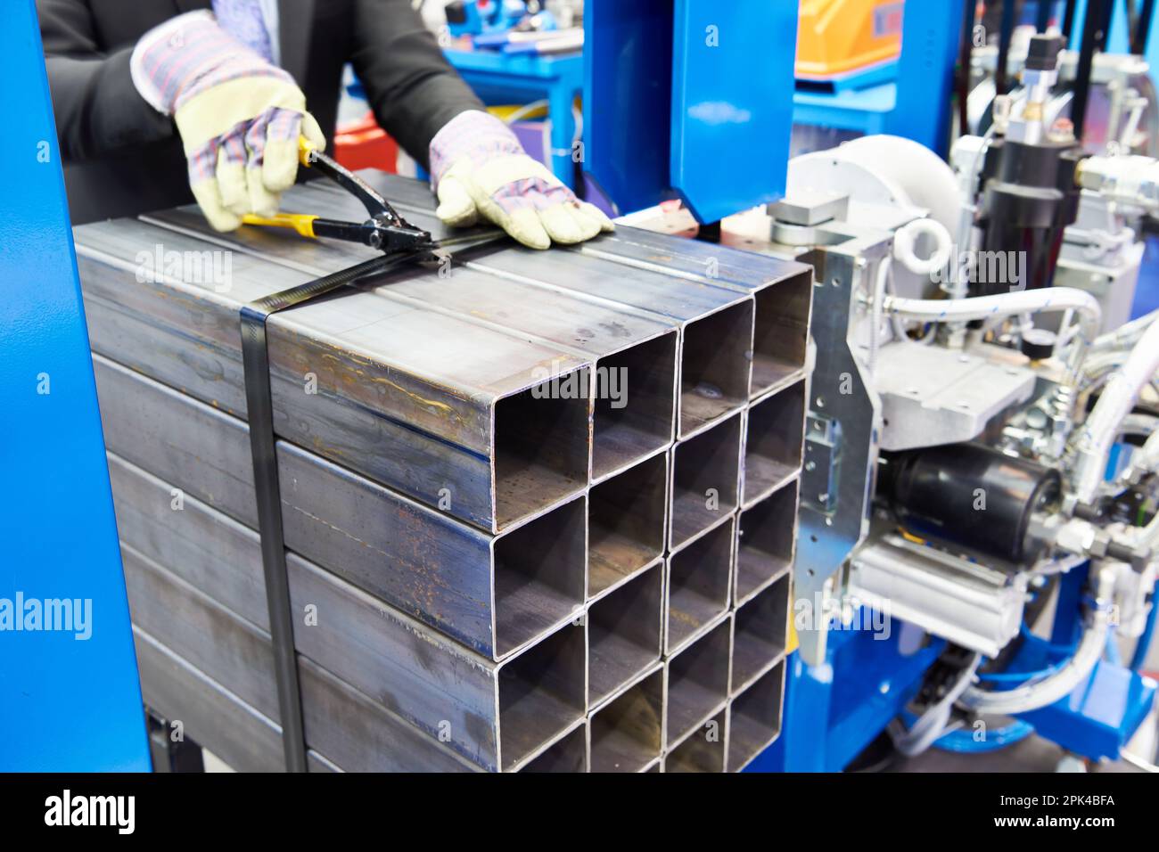 Machine for packing metal parts Stock Photo - Alamy