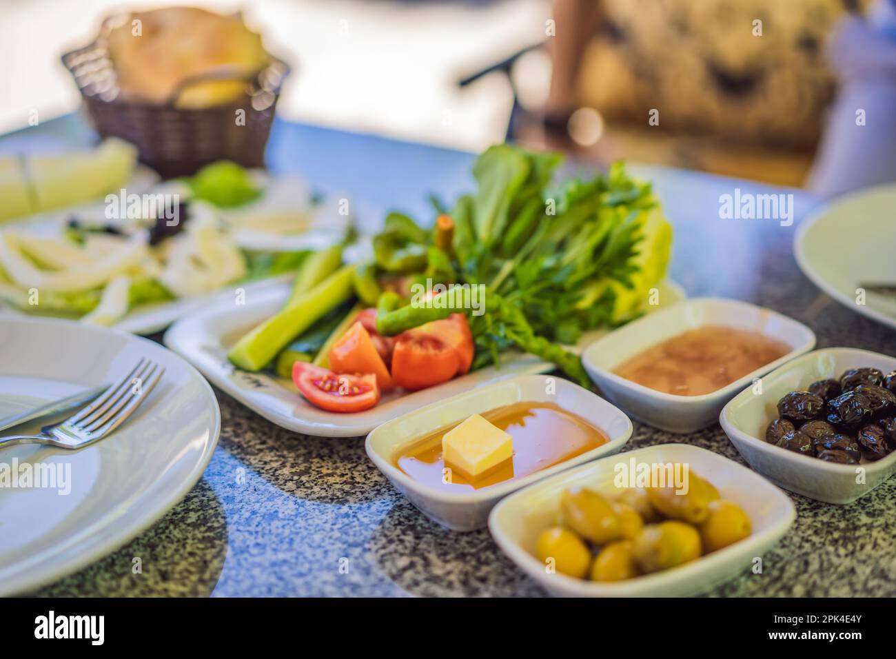 Turkish breakfast table. Pastries, vegetables, greens, olives, cheeses ...