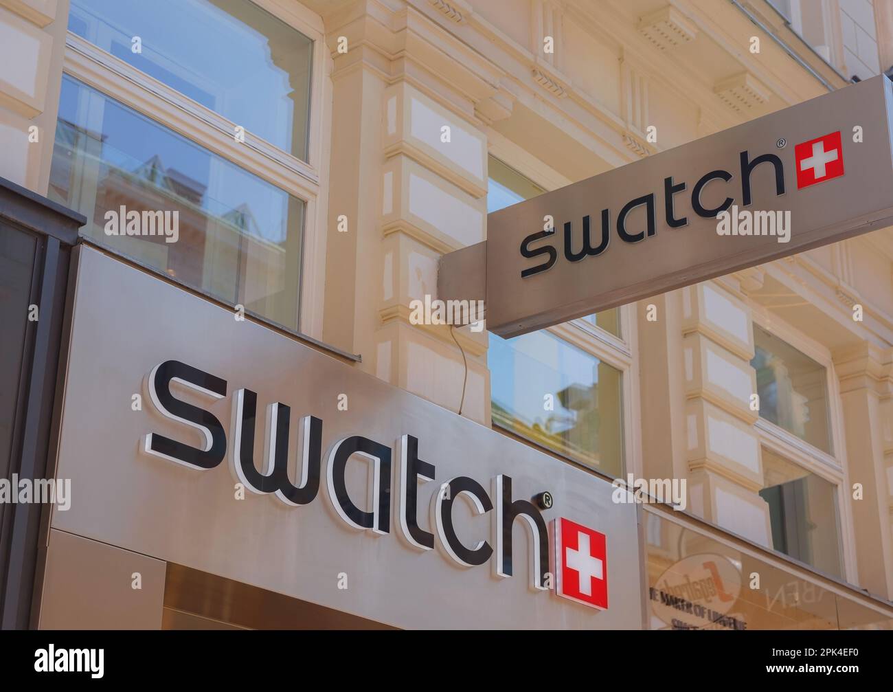 Vienna, Austria - August 11, 2022: Facades of buildings Swatch store ...