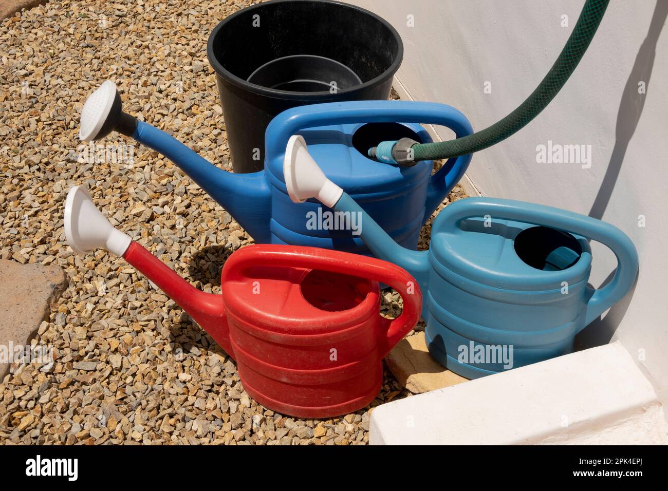 Langebaan, west coast, South Africa. 2023. Watering cans being filled ...