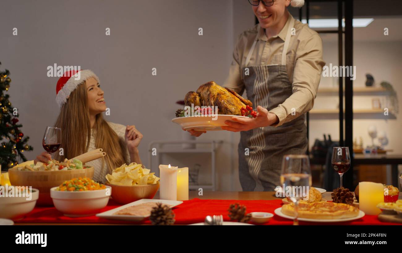 Family celebrating Christmas together eating special food in the ...