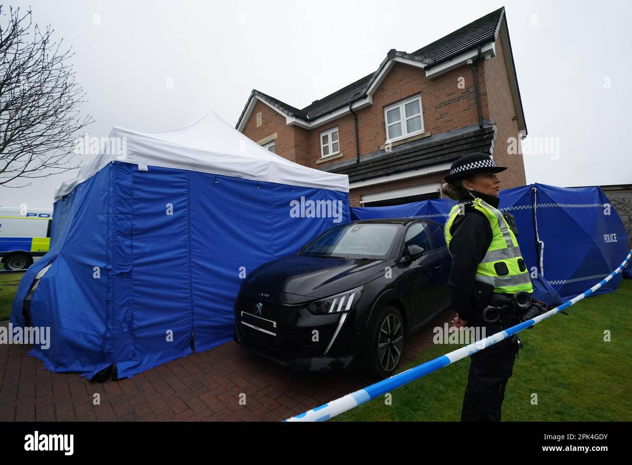 Officers from Police Scotland outside the home of former chief ...