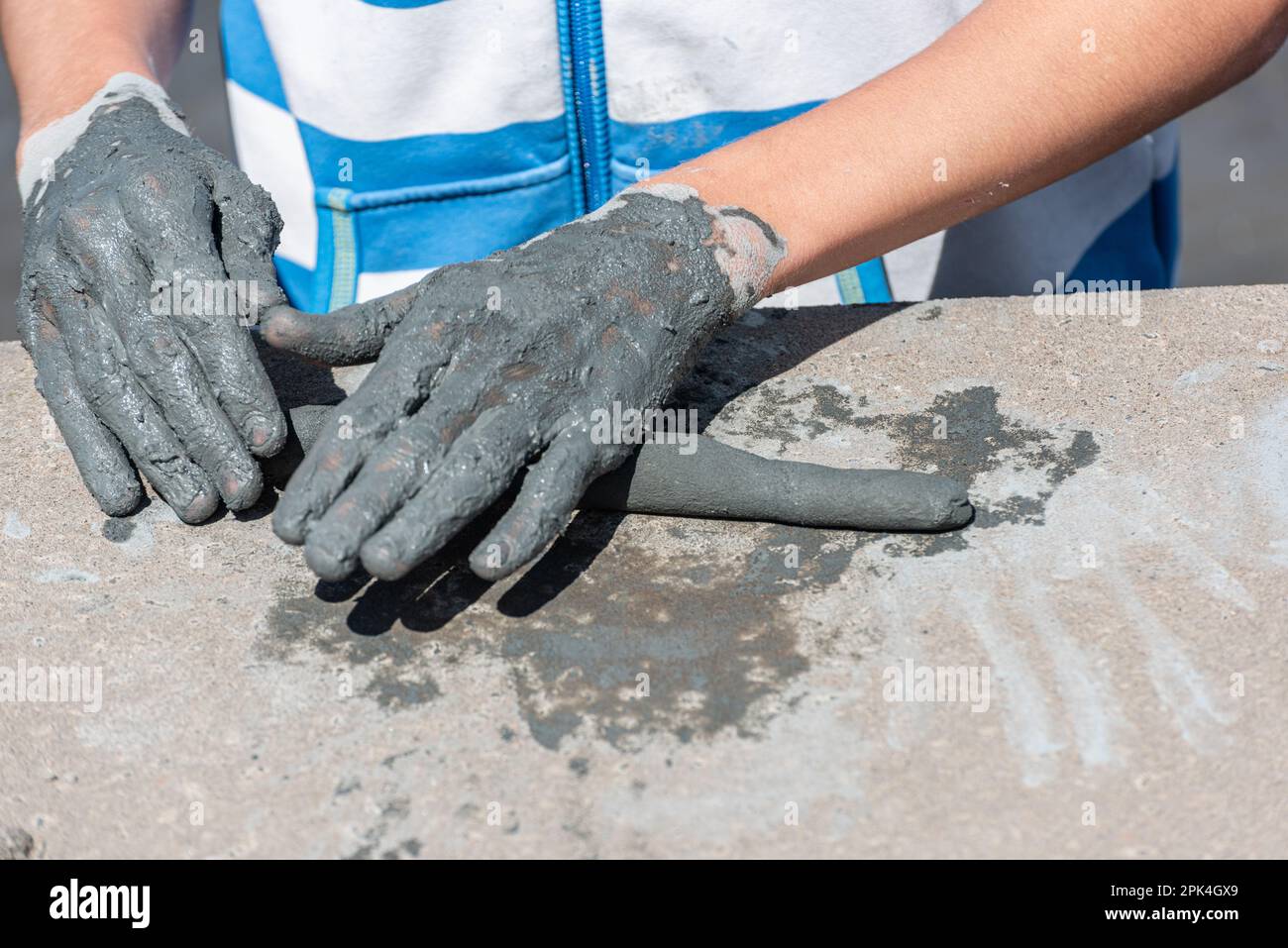 Two hands forming a lump of clay Stock Photo - Alamy