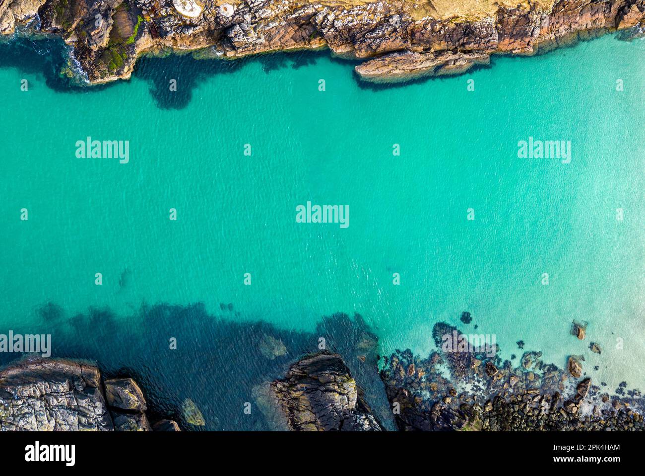 Aerial drone view of Port of Stoth on the Isle of Lewis. Turquoise sea ...