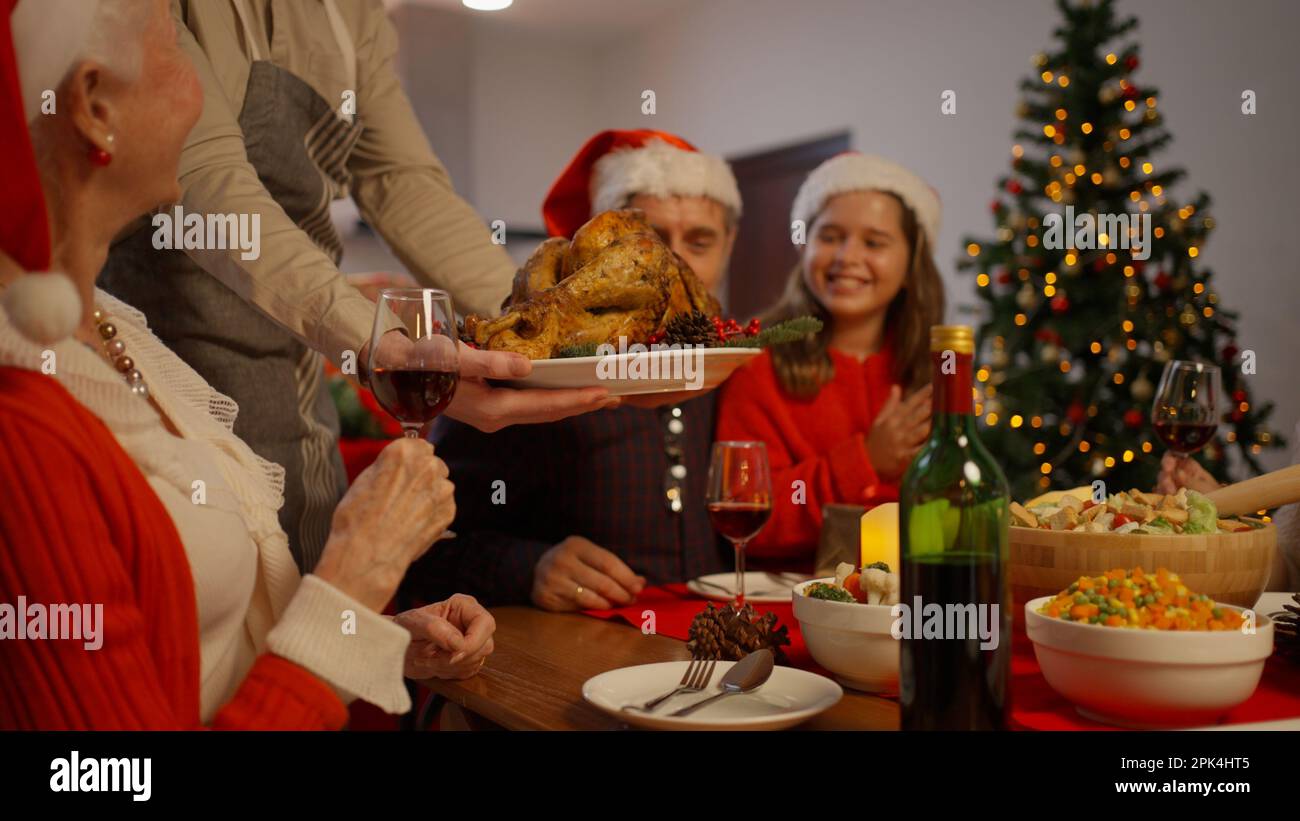 Family celebrating Christmas together eating special food in the ...