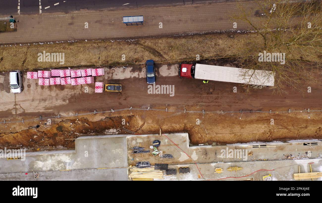 Drone photography of unloading semi truck with a forklift in a ...