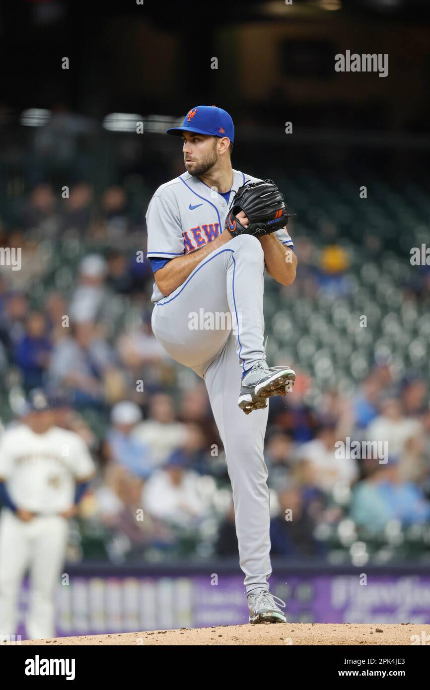 New York Mets starting pitcher David Peterson (23) throws to the ...