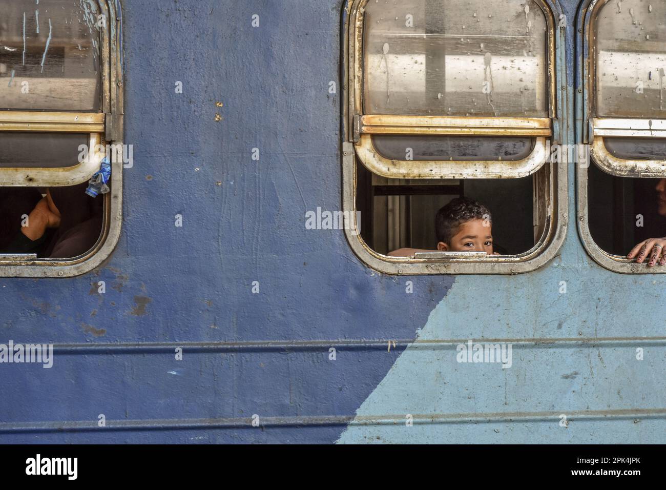 An Egyptian child looks sad on a train from Alexandria to Cairo Stock ...