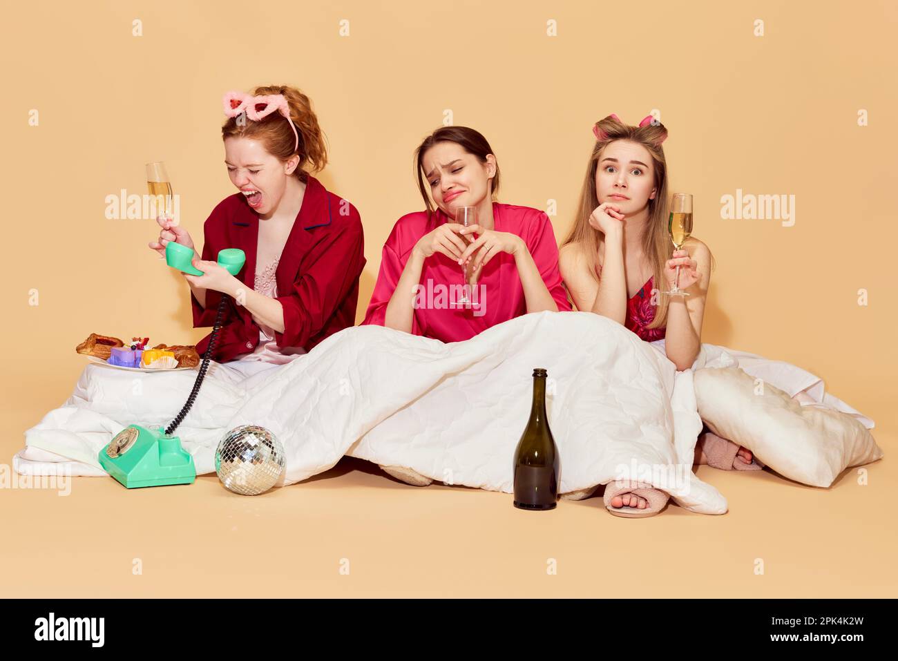 After break up. Friends, young girls in pajamas talking, drinking ...