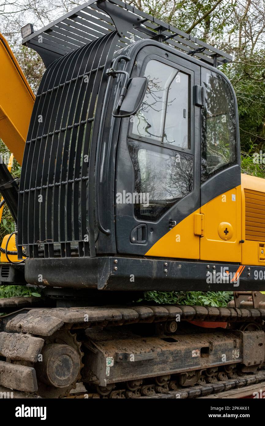 Digger on back of lorry waiting to be unloaded Stock Photo - Alamy
