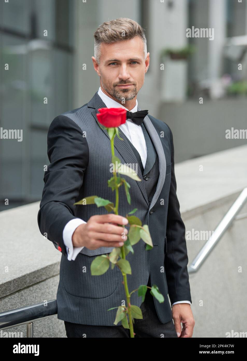 elegant man in black tuxedo. man wearing tuxedo outdoor. tuxedo man ...