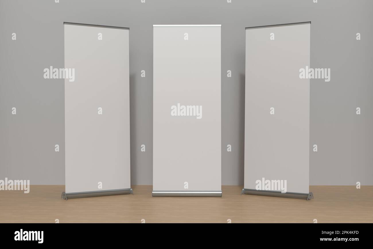 Set of three blank rollup banners, on a laminate floor infront of a ...