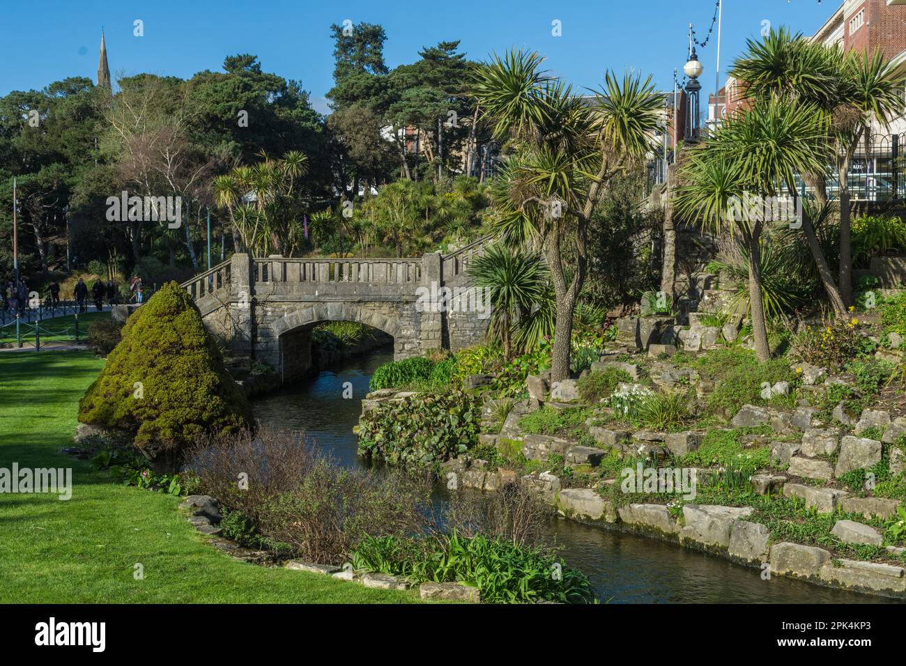 Bournemouth, UK - April 2nd 2023: A small stone footbridge over the ...