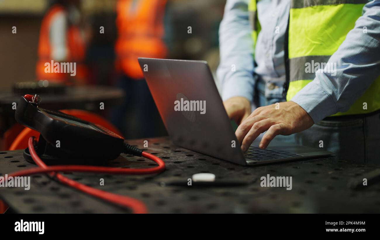 Programming robot controller, Programming robotic arms in factory industrial Stock Photo - Alamy