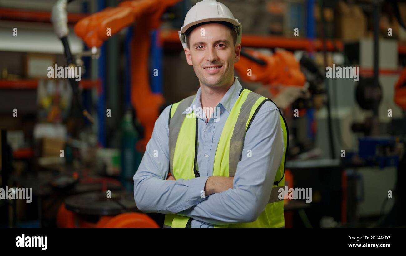 Robotic engineers operating machine hi-res stock photography and images ...
