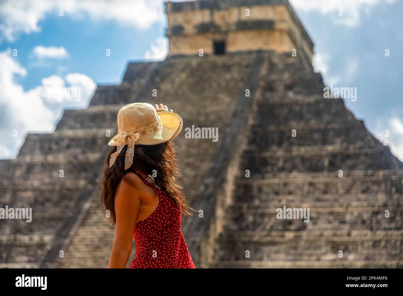 Tourist observing the old pyramid and temple of the castle of the Mayan ...
