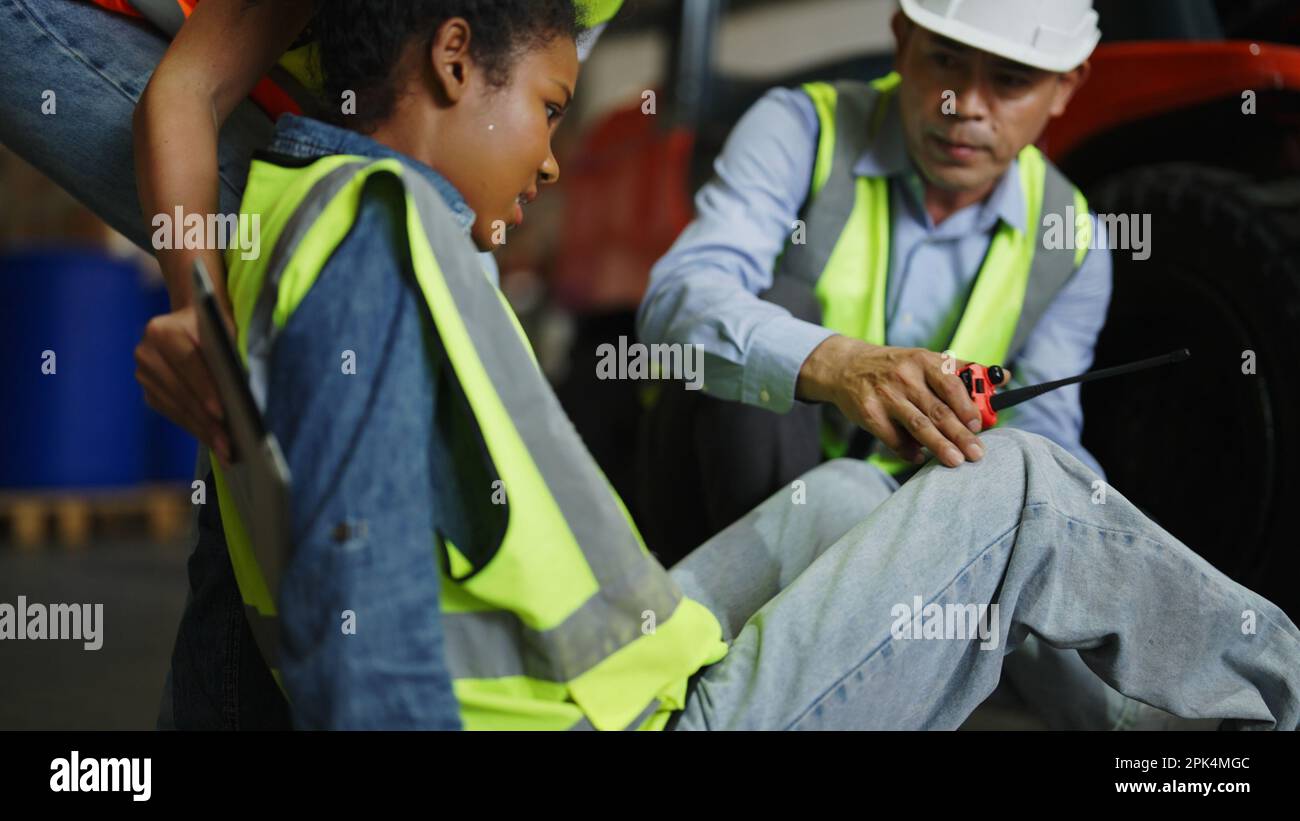 Industrial warehouse staff having accident in the factory Stock Photo ...