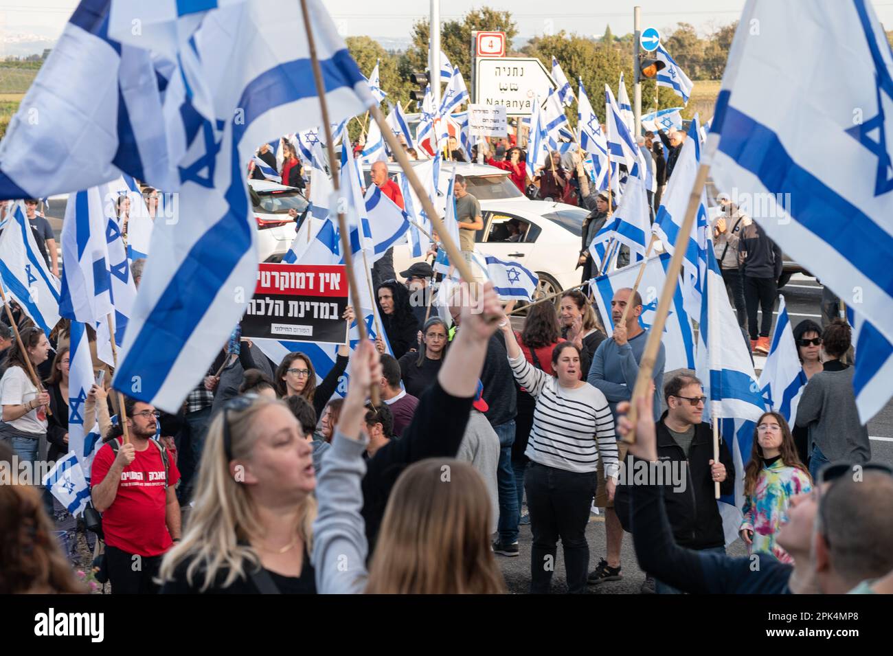 Israelis collect outside a shopping centre at Mishmar HaSharon for ...