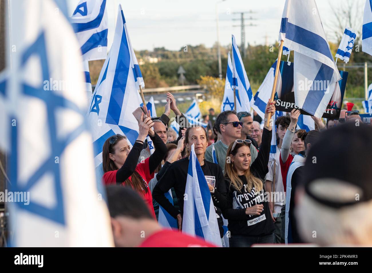 Israelis collect outside a shopping centre at Mishmar HaSharon for ...