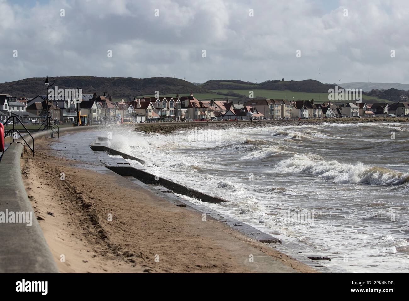 High tide and stormy seas batter the West shore of Llandudno, North ...