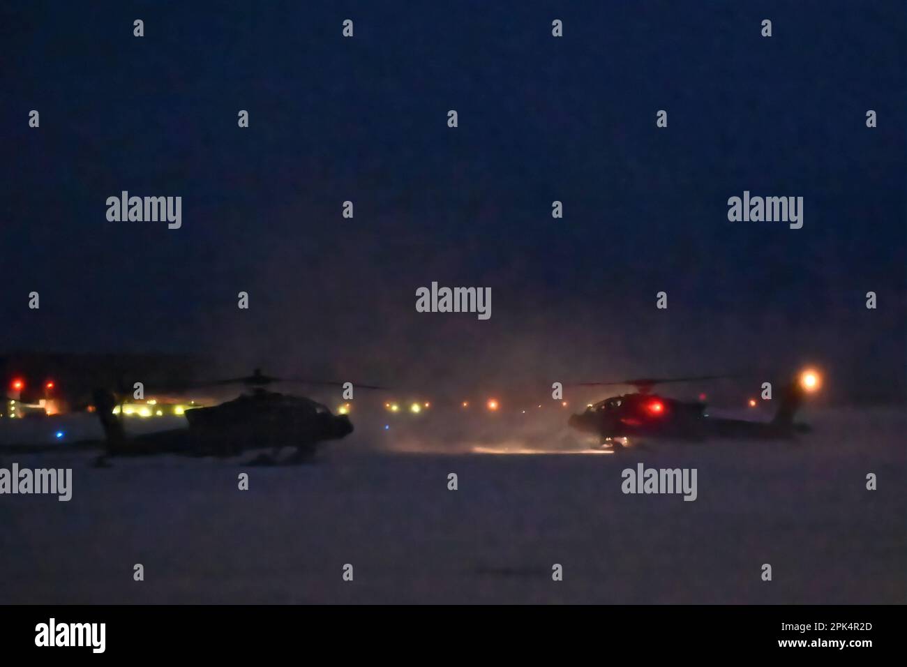 Snow obscures an AH-64 Apache helicopter from the 1st Battalion, 25th ...