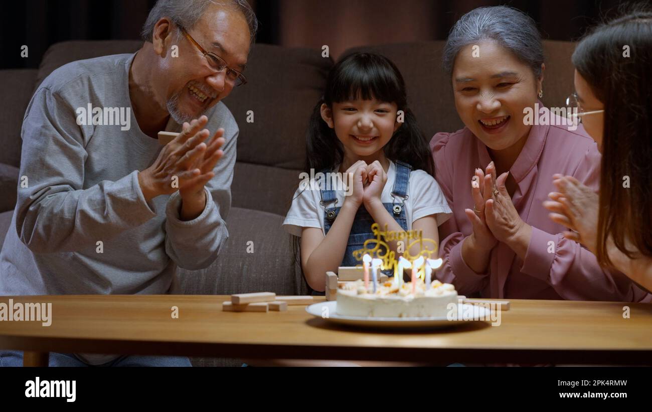 Family celebrating birthday party with happiness at home Stock Photo ...