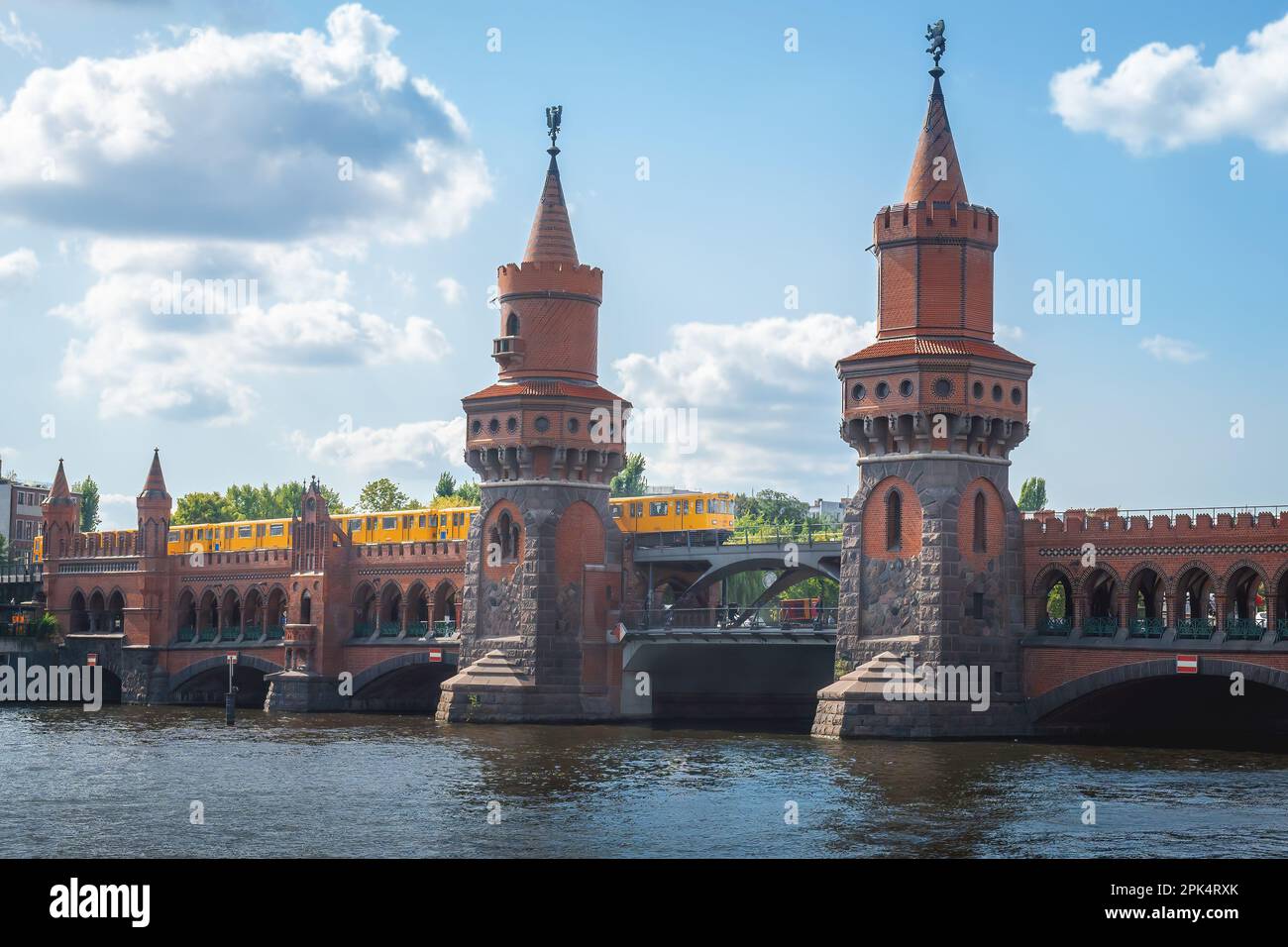 Yellow train at Oberbaum Bridge (Oberbaumbrucke) - Berlin, Germany ...